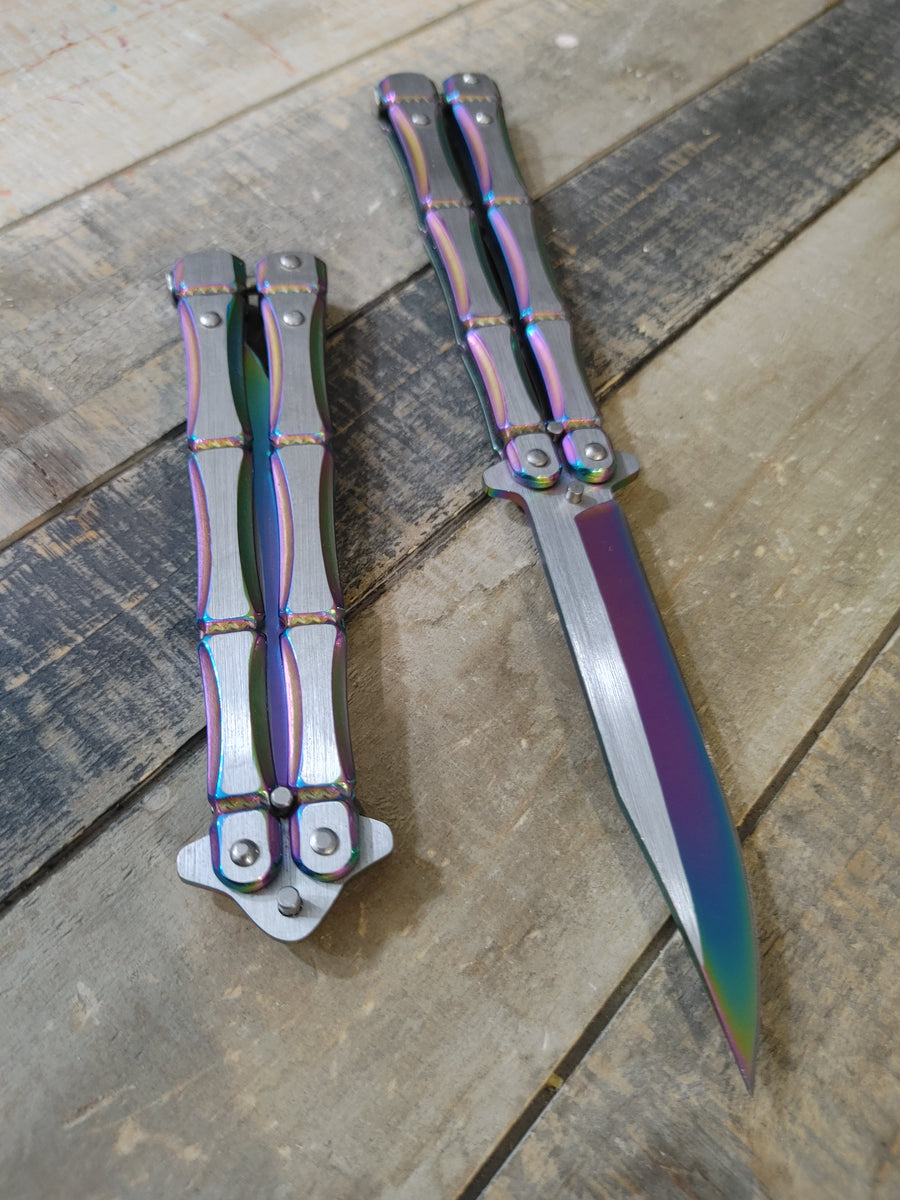 “Bones” Butterfly Knife – 1065 Steel – Rainbow – PB TACTICAL